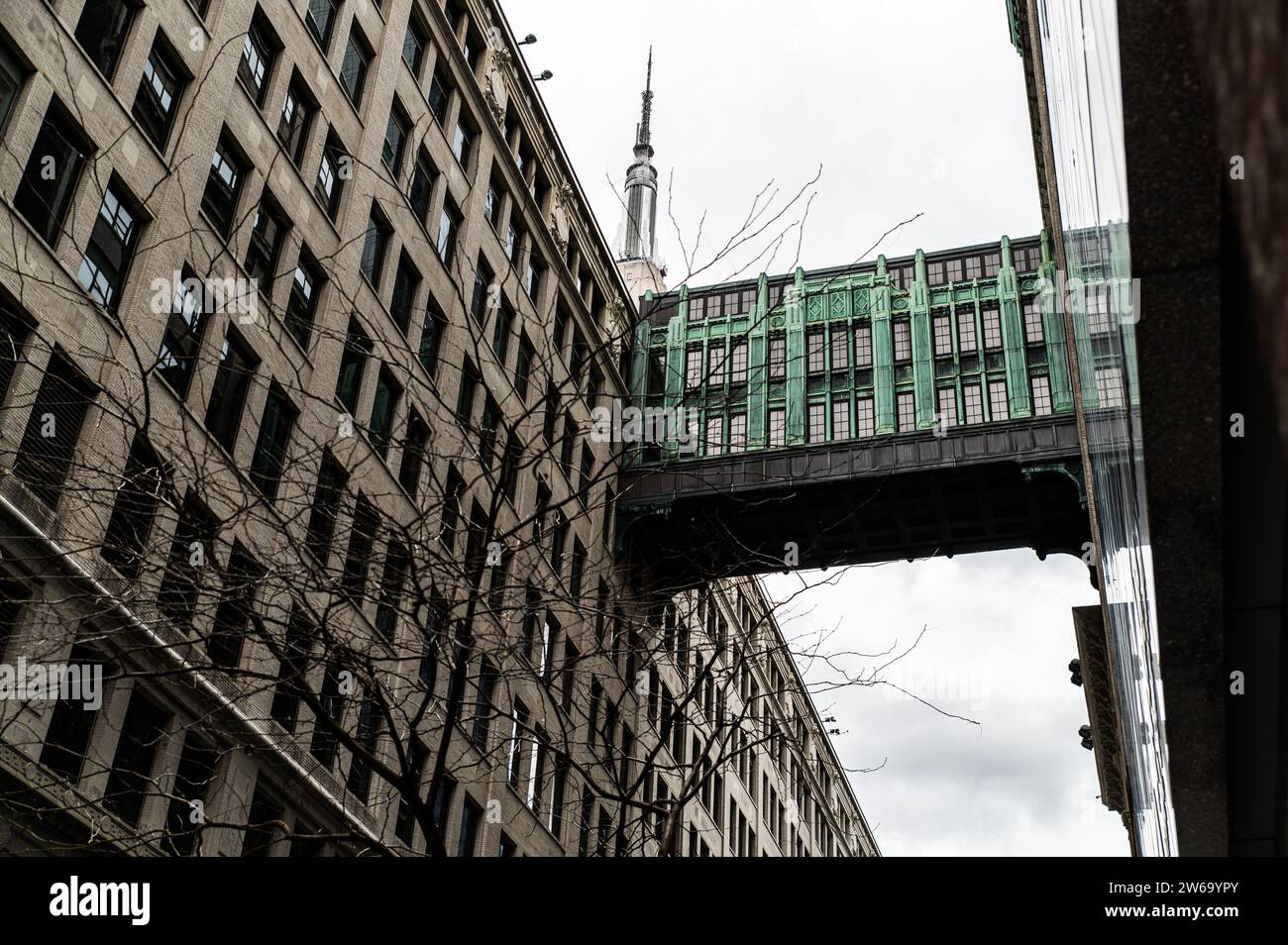A vibrant green skywalk and a relic of retail history with architecture ...