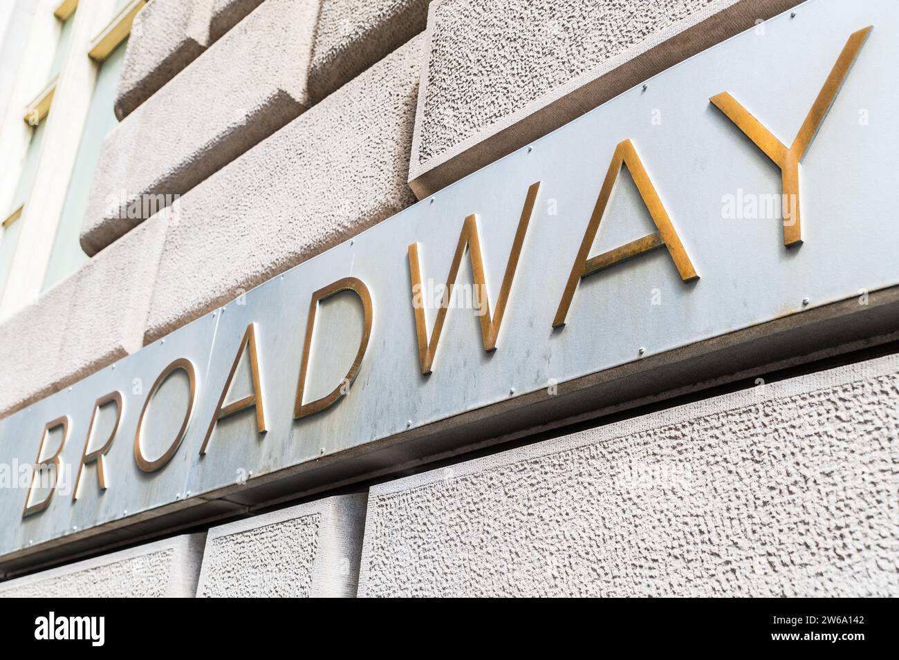 Low angle of exterior of modern building with inscription Broadway in ...