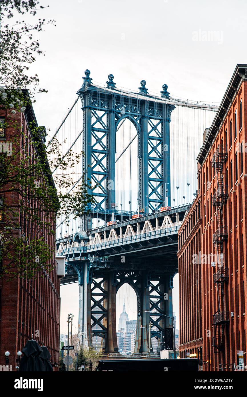 A picturesque view of the Manhattan Bridge as seen from a cobblestone ...