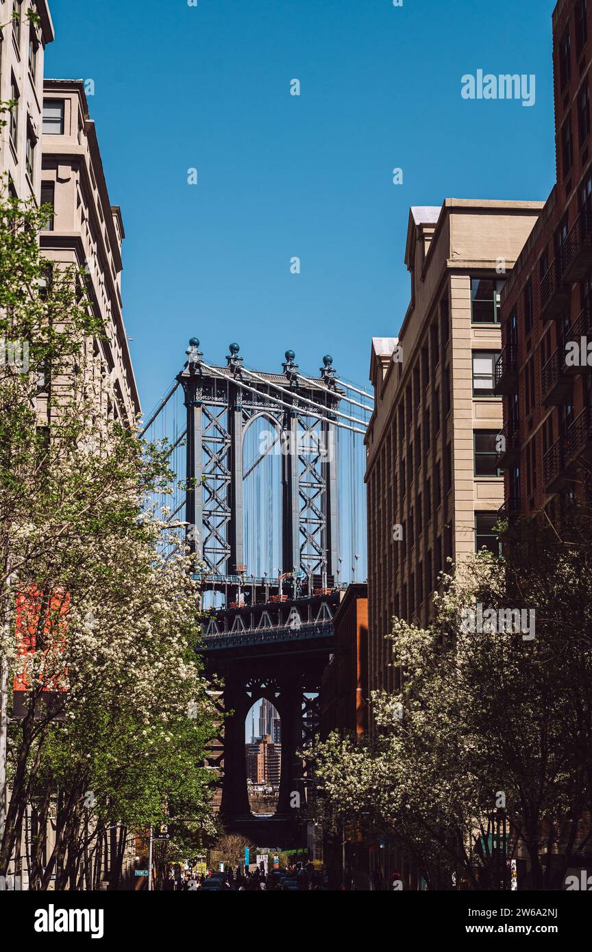 A vibrant street scene in DUMBO, Brooklyn, capturing the iconic ...