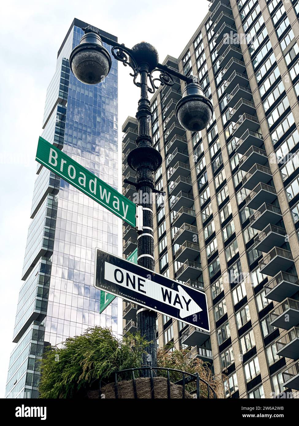 Low angle of Broadway location direction and one way sign boards ...