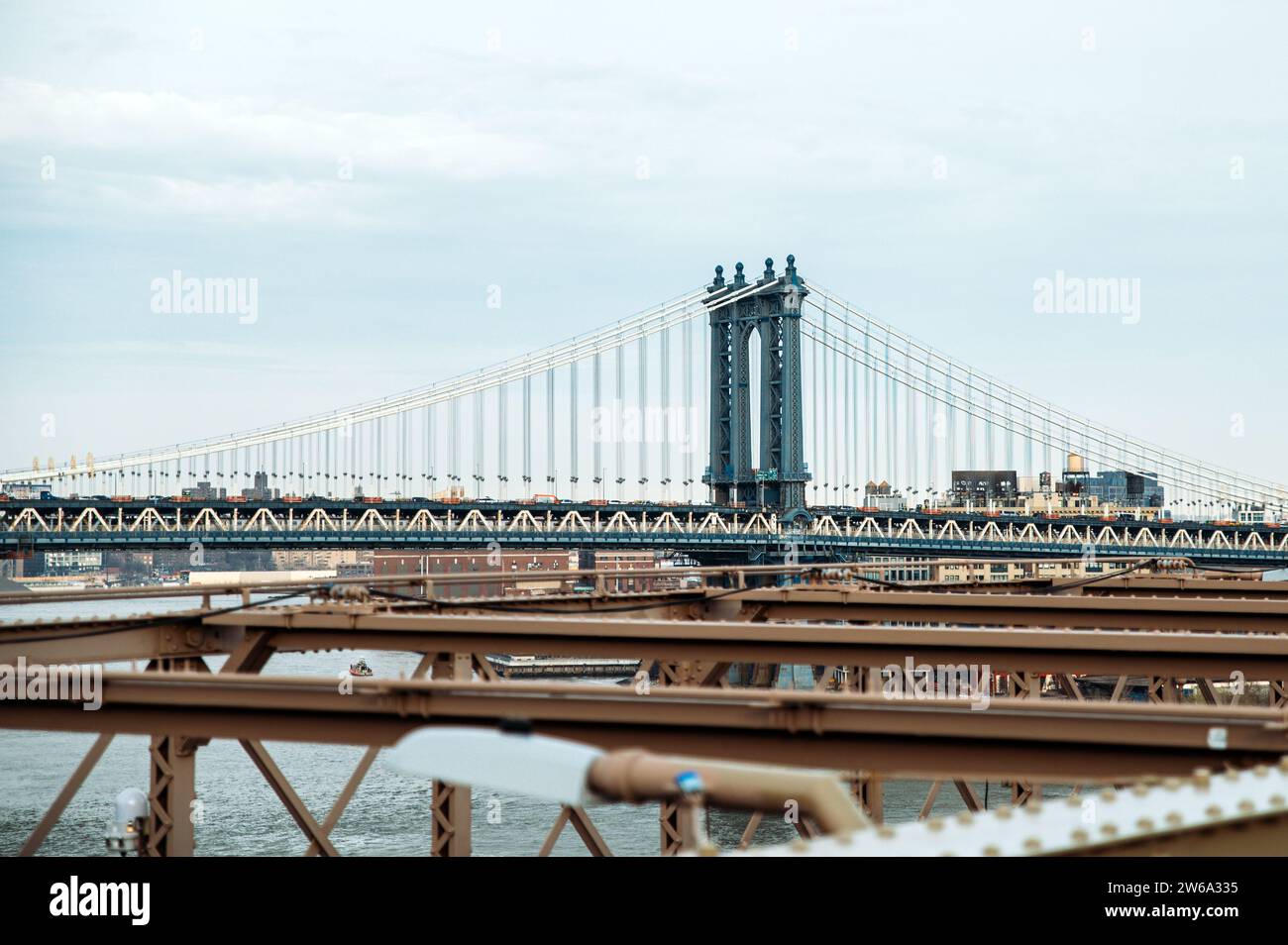Distant view of the Manhattan Bridge with its detailed architecture and ...