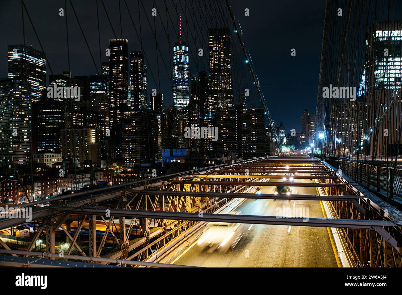 Nighttime cityscape featuring the bright lights of Manhattan ...