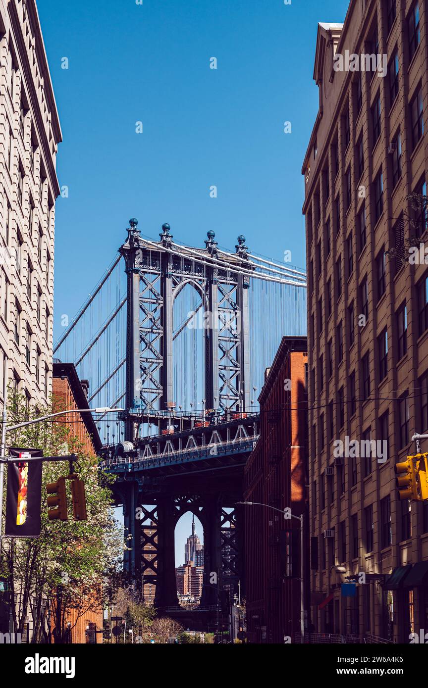 A vibrant street scene in DUMBO, Brooklyn, capturing the iconic ...