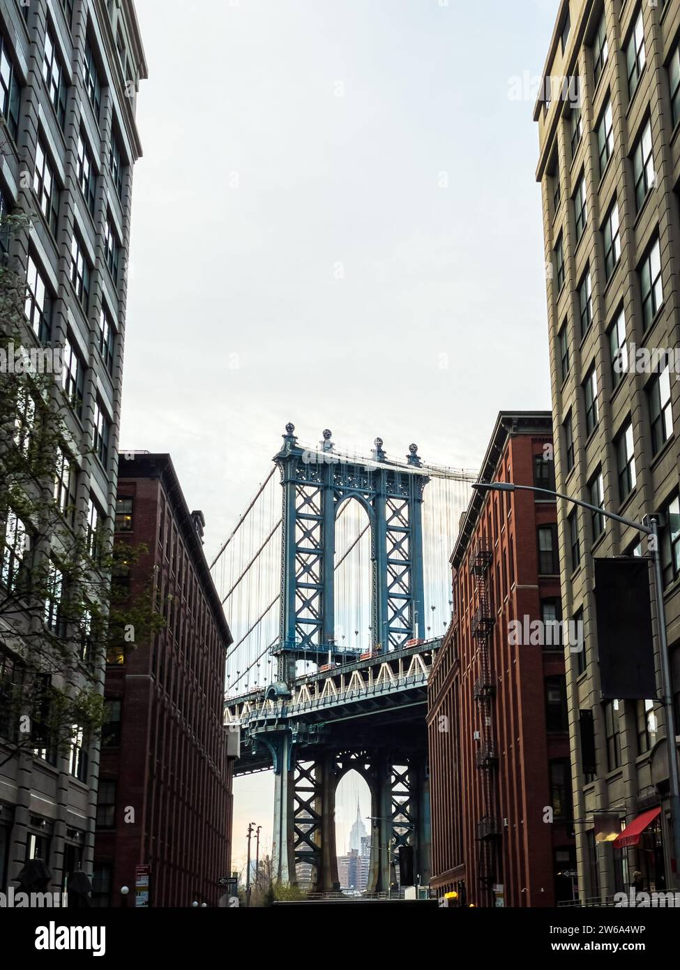 A vibrant street scene in DUMBO, Brooklyn, capturing the iconic ...