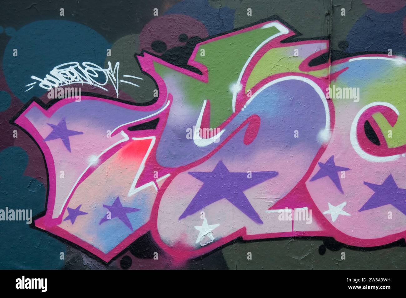 Urban street art. Colourful graphic graffiti letters and stars, painted ...