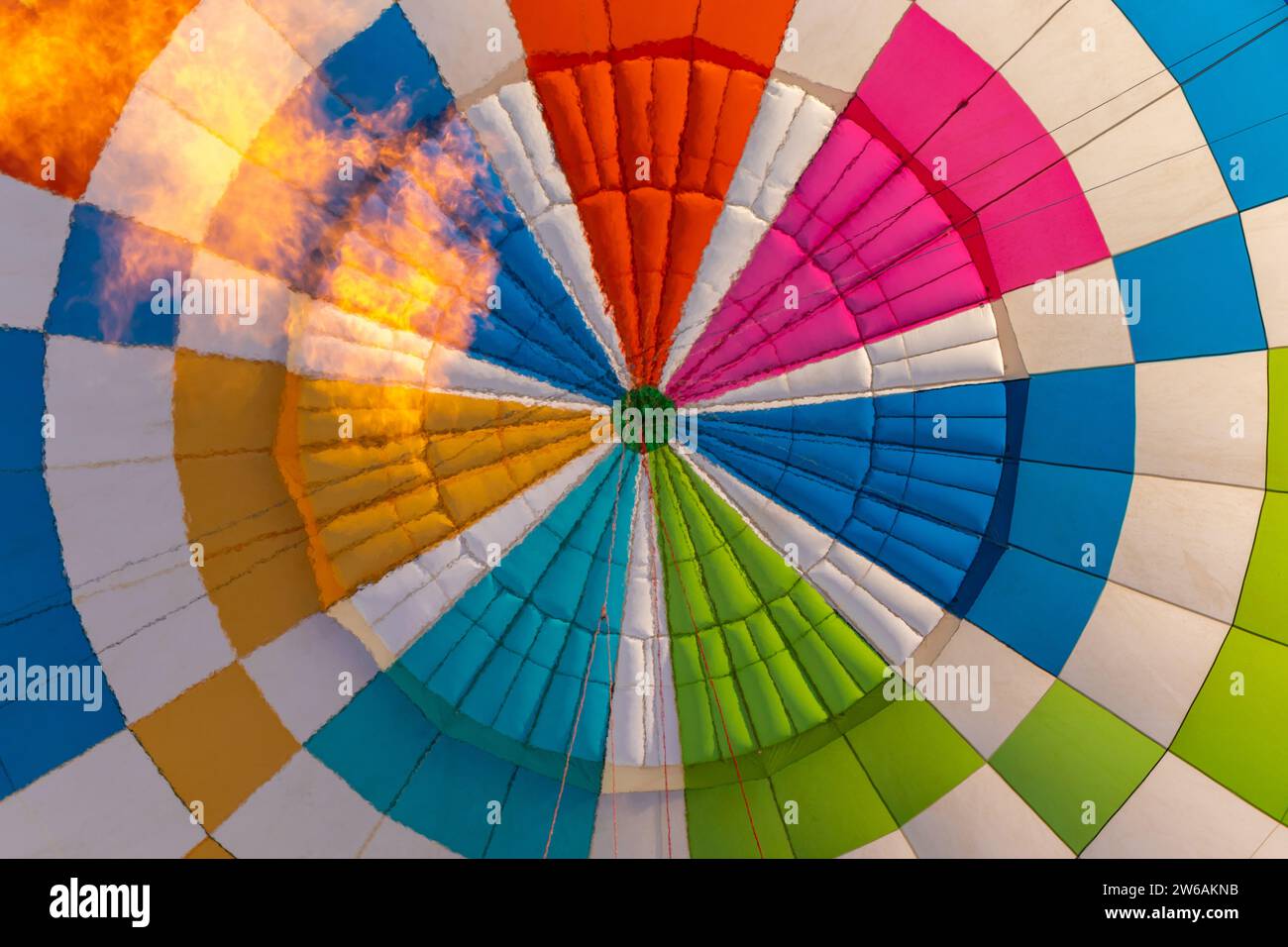 From below of colorful hot air balloon floating in sky during event at ...