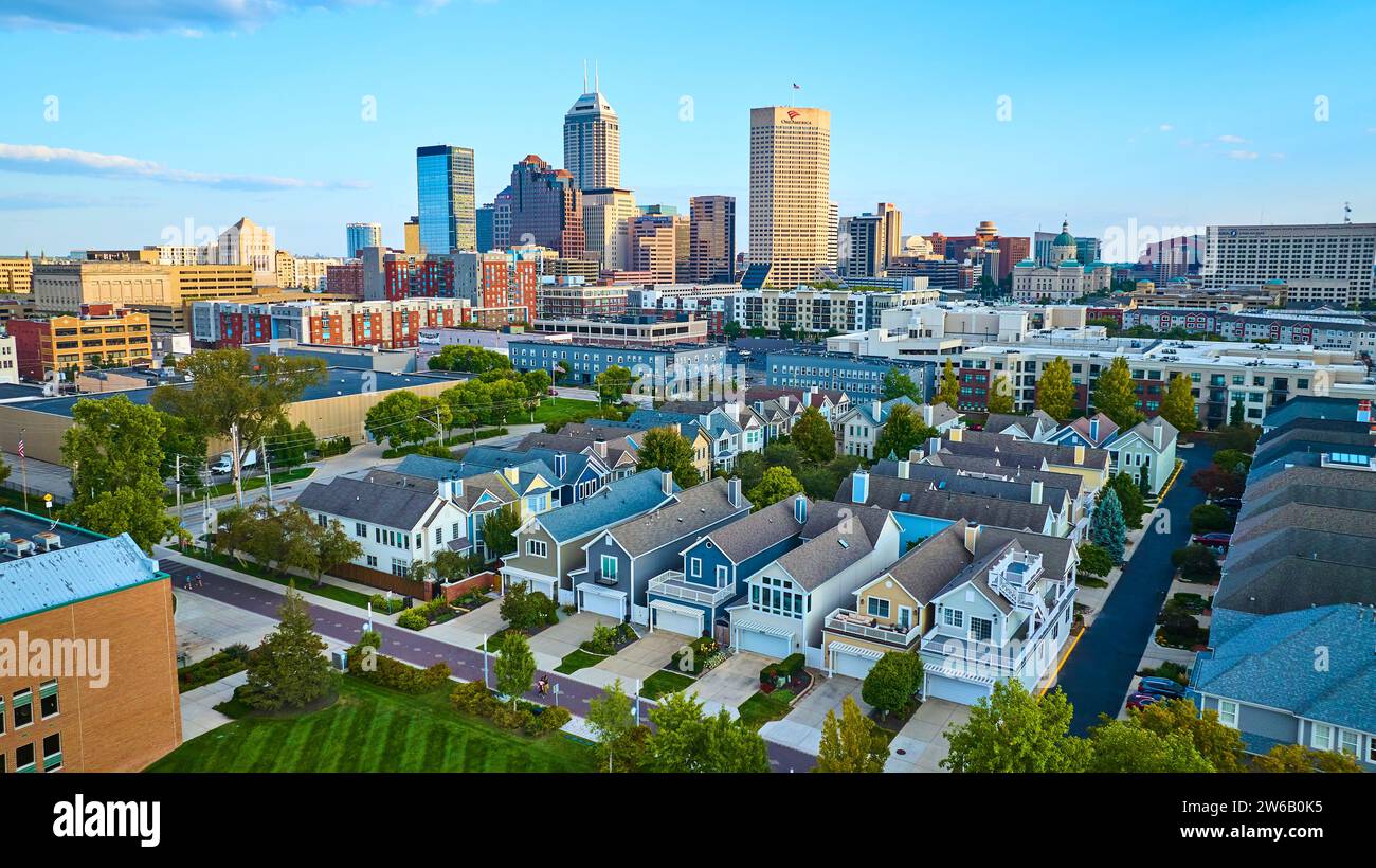 Aerial View of Suburban Homes and City Skyline at Golden Hour Stock ...