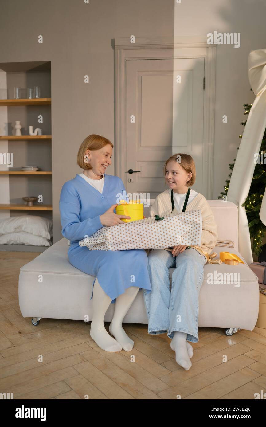 Seated woman presents child hi-res stock photography and images - Alamy