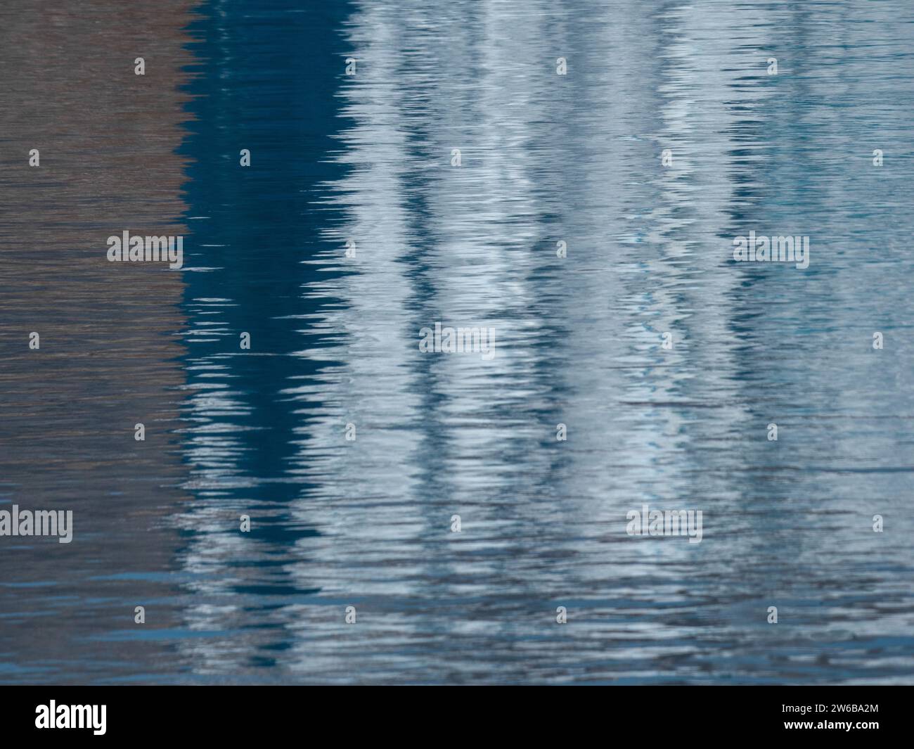 Water surface with iceberg reflections in a fjord in Greenland Stock ...