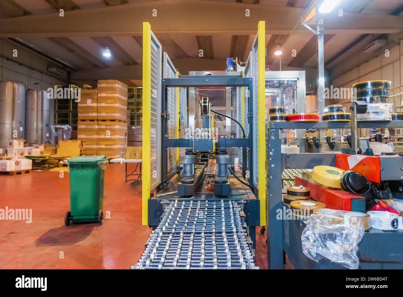 Trapping machine for industrial packaging line placed on factory ...