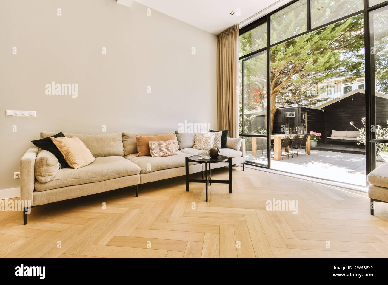 Interior of spacious living room with comfortable sofa and coffee table ...