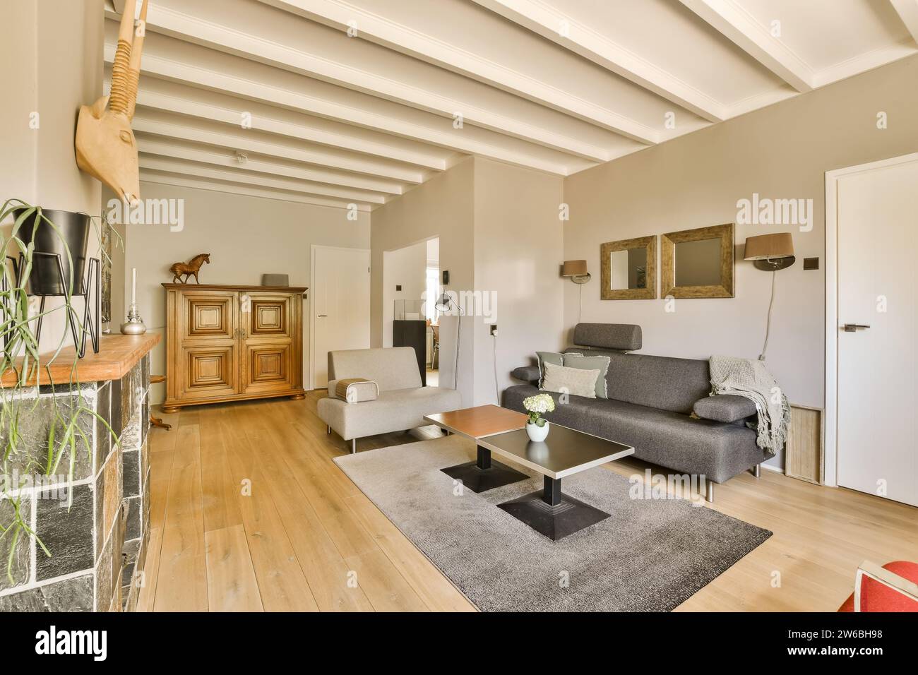 Comfortable couch with chair and coffee table in spacious living room ...