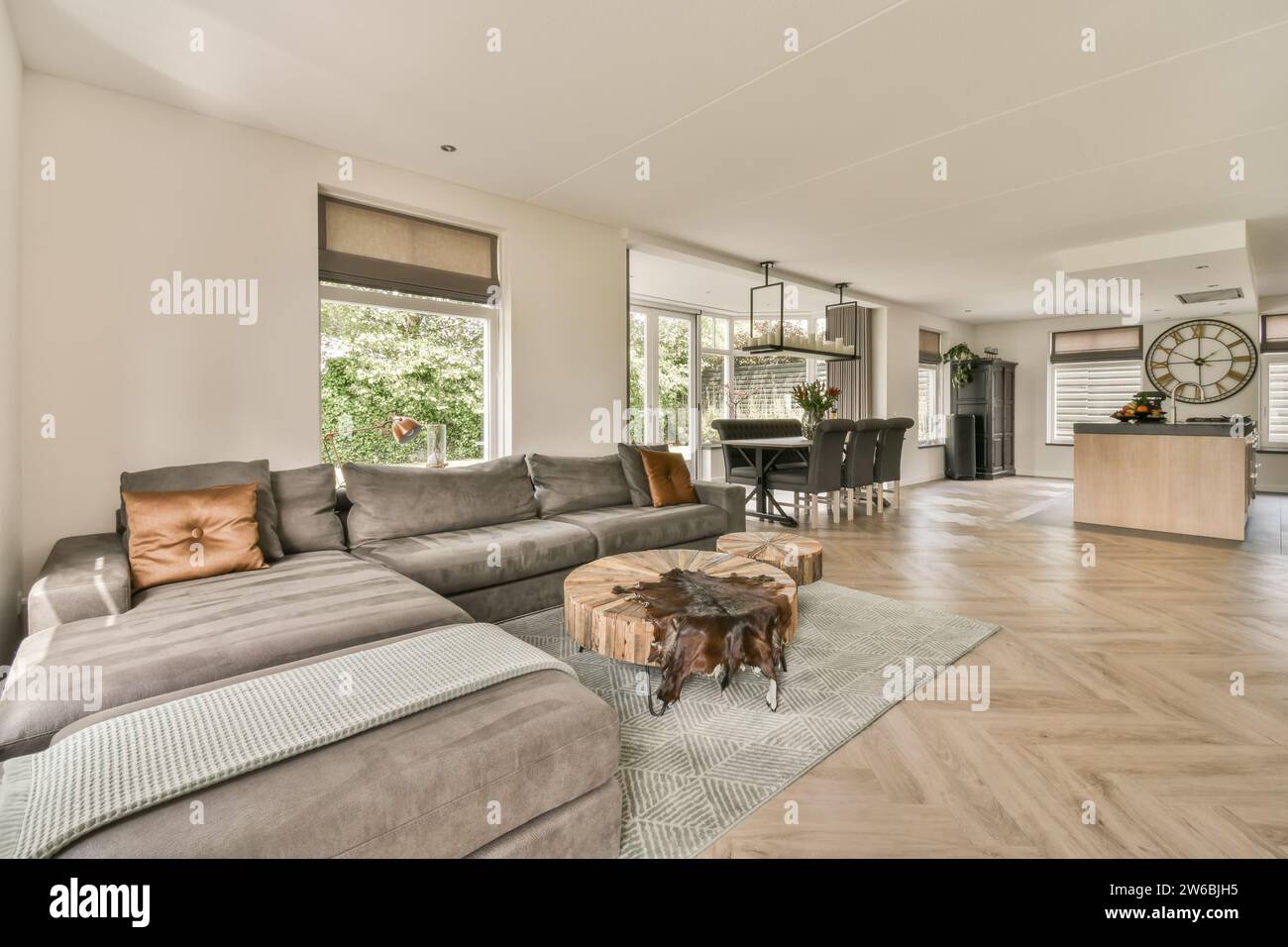 Animal skin decor on wooden coffee table by sofa over carpet near ...