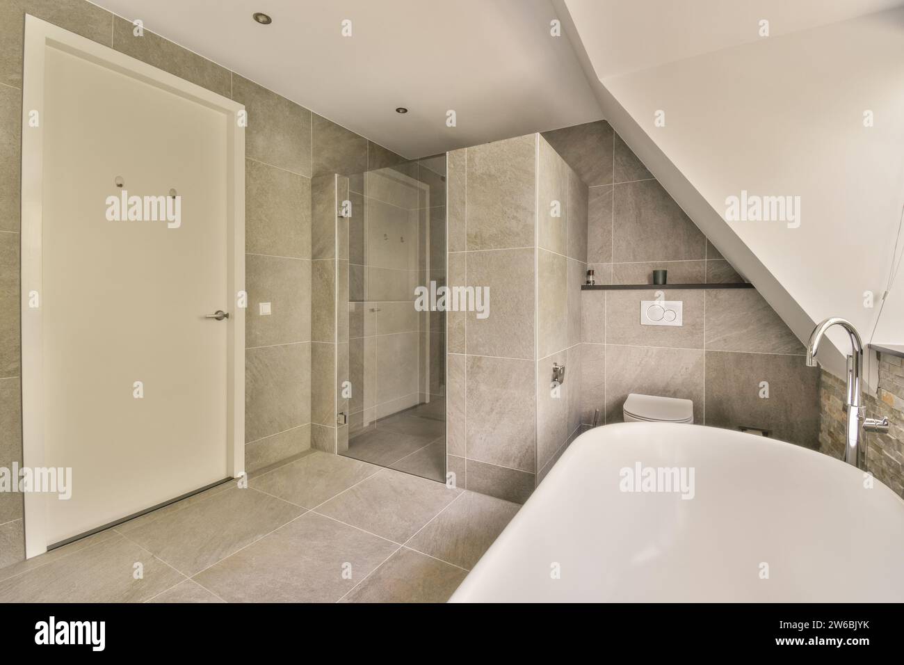 Interior of contemporary bathroom with bathtub and shower booth with ...