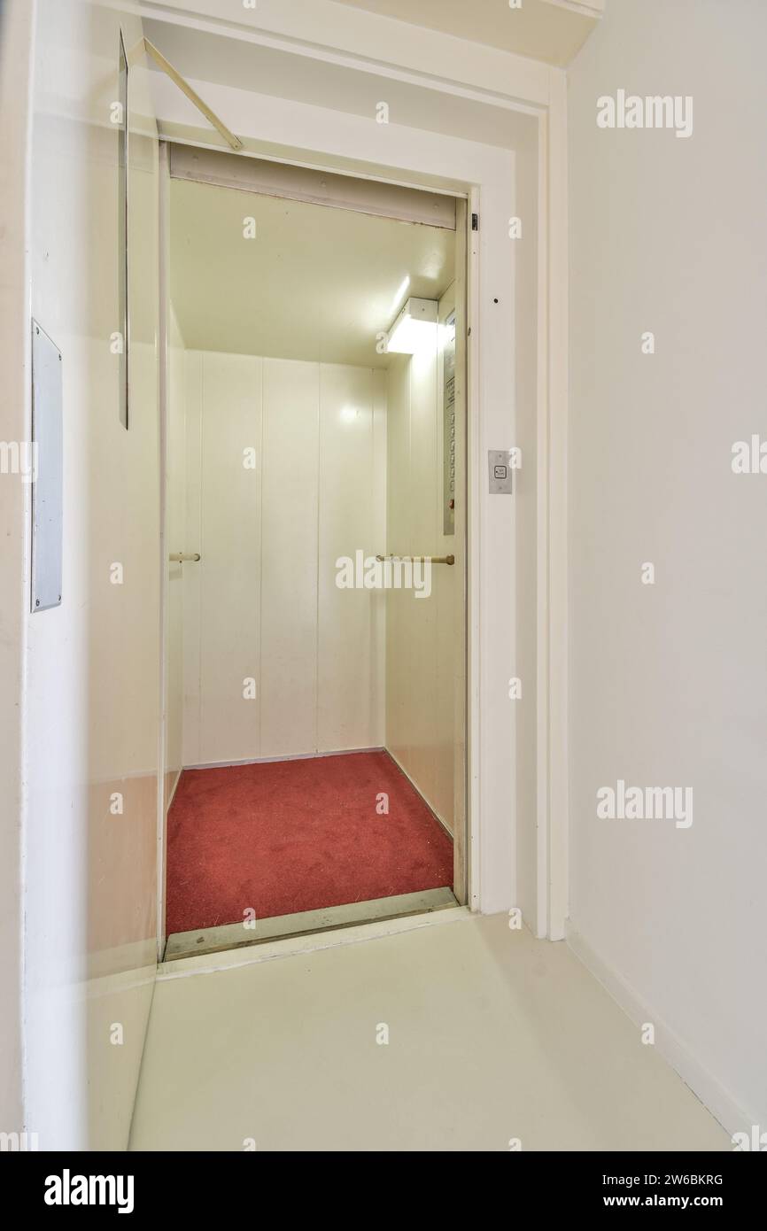 An empty modern elevator cabin with open doors, showcasing a clean ...