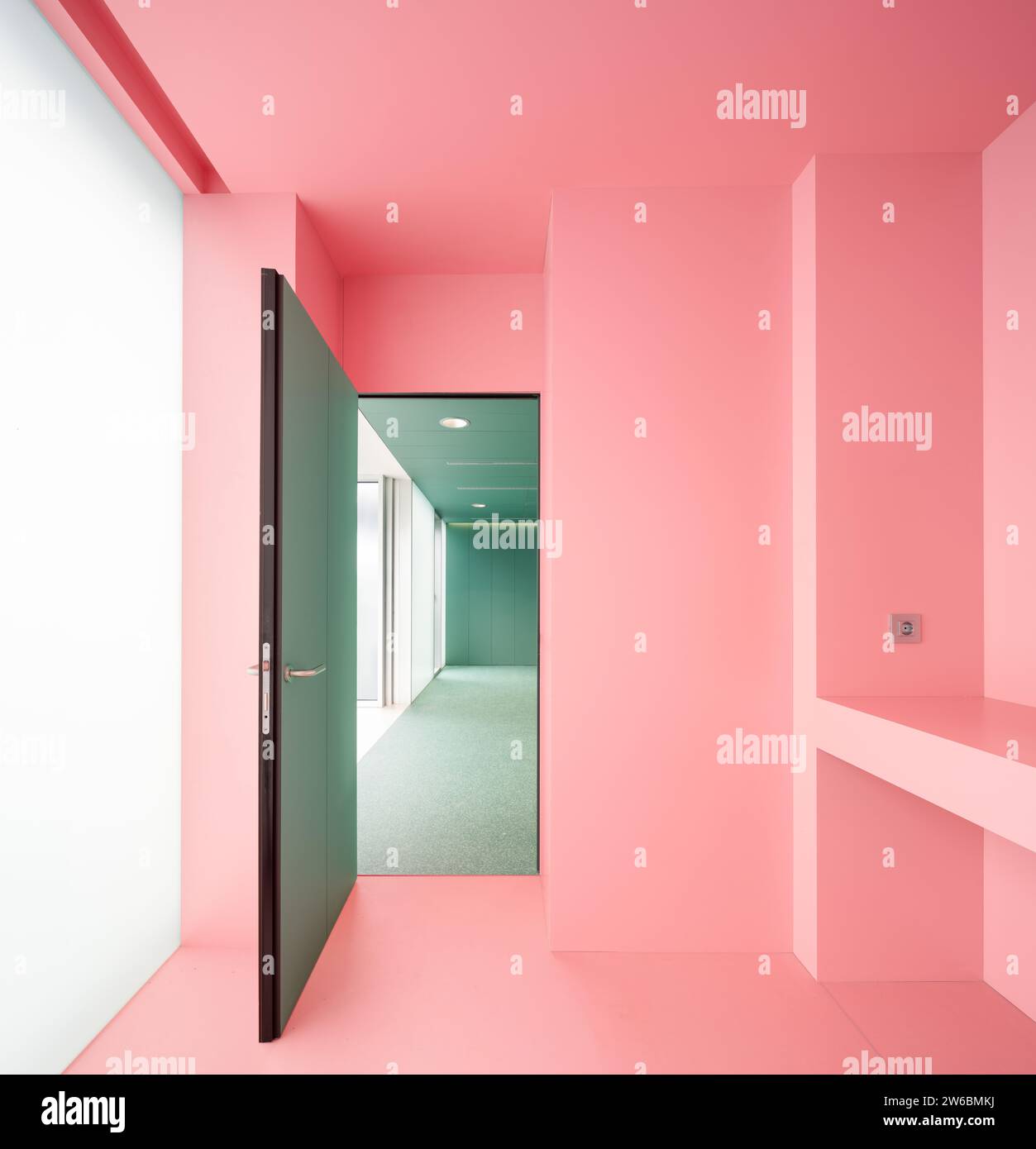 Interior of empty pink room with open door in hospital Stock Photo - Alamy