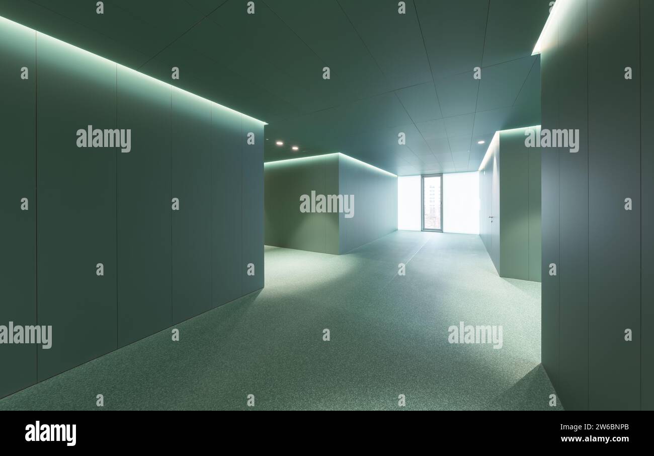 Interior of illuminated green passage with green walls and glass door ...