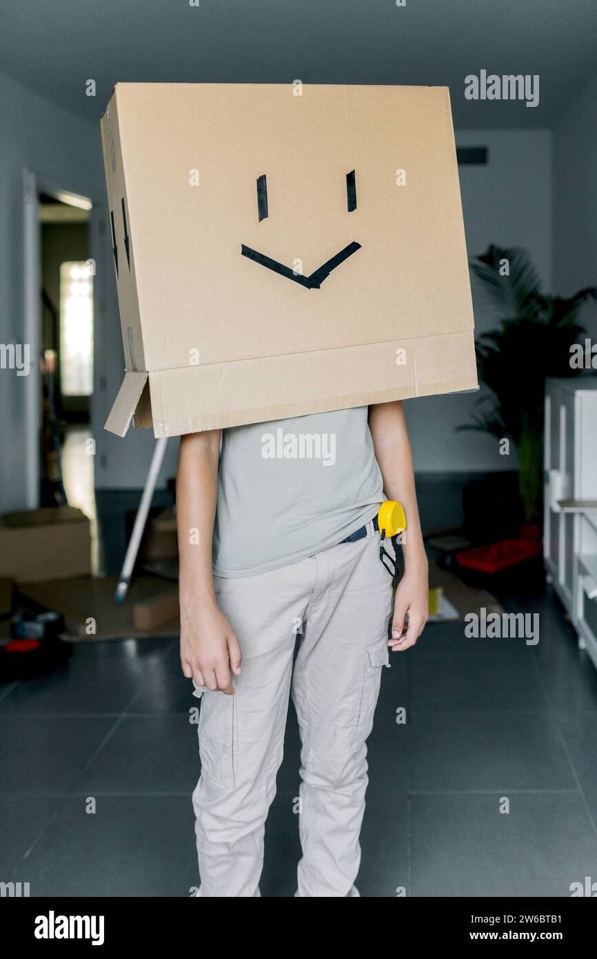 Faceless person in casual clothes covering head and shoulders with ...