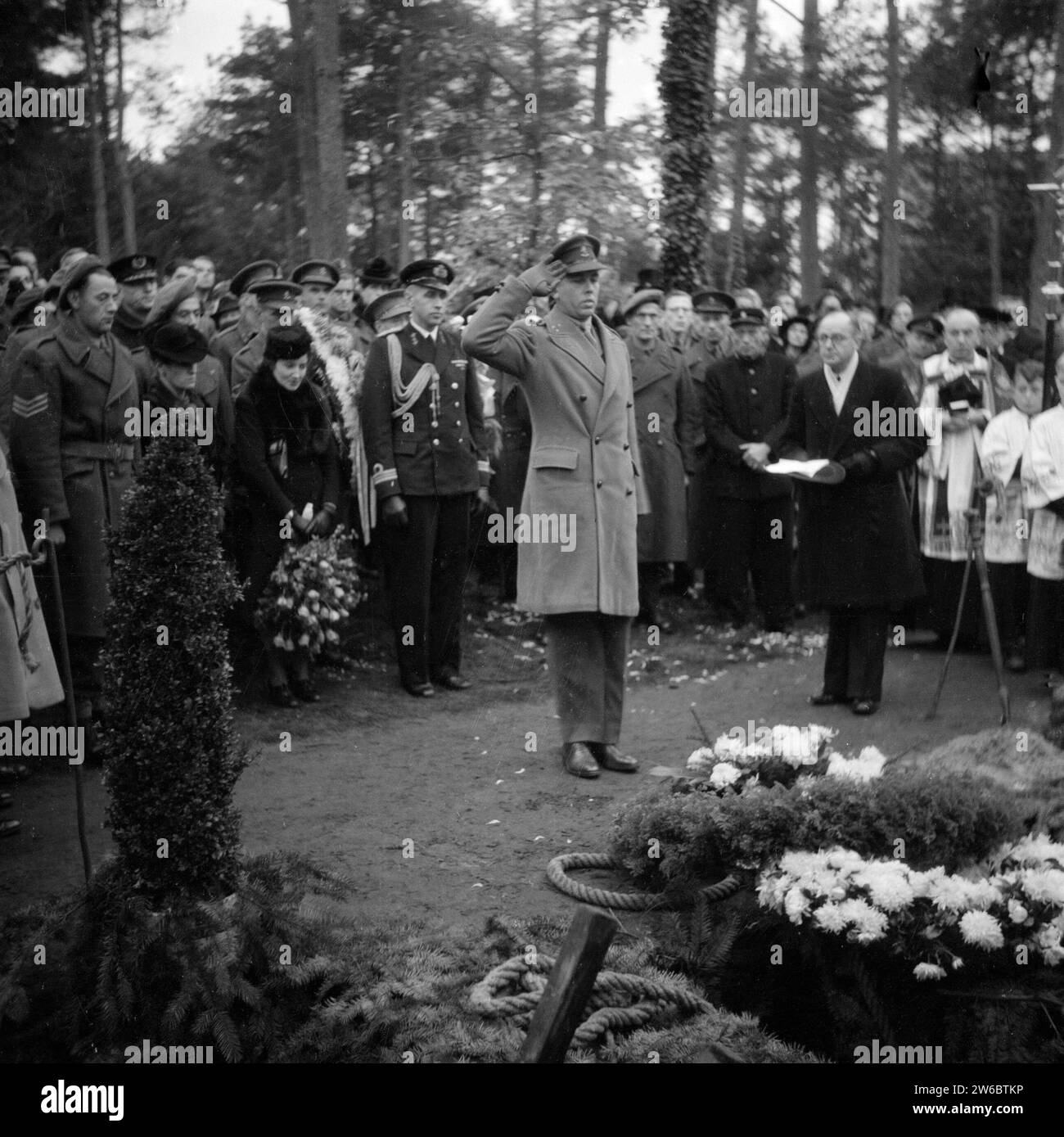 An army officer salutes during a military funeral ca. undated Stock ...