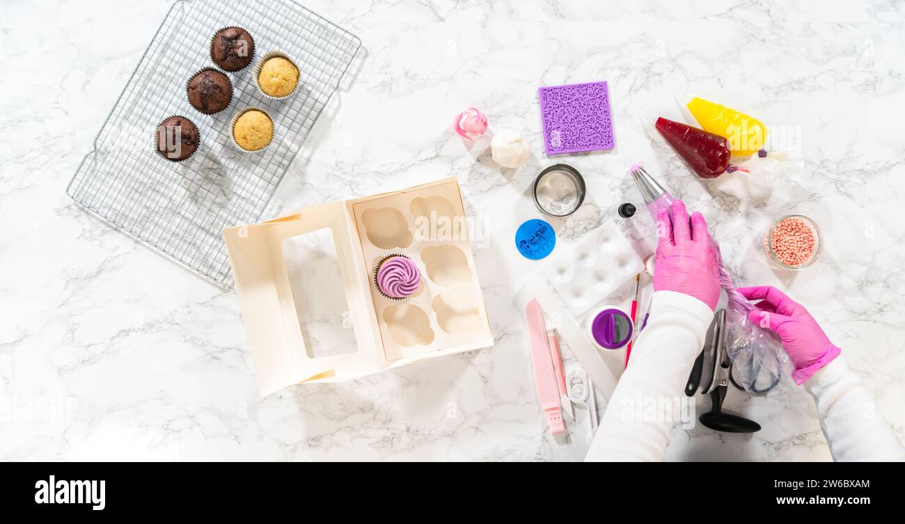 Creating Extravagant Cupcakes for Birthday Celebration Stock Photo - Alamy