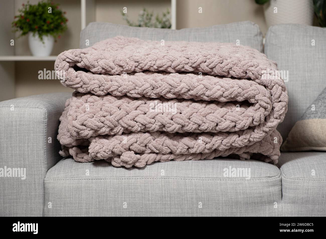 Knitted large plaid blanket in dusty rose light grayish-red color on ...
