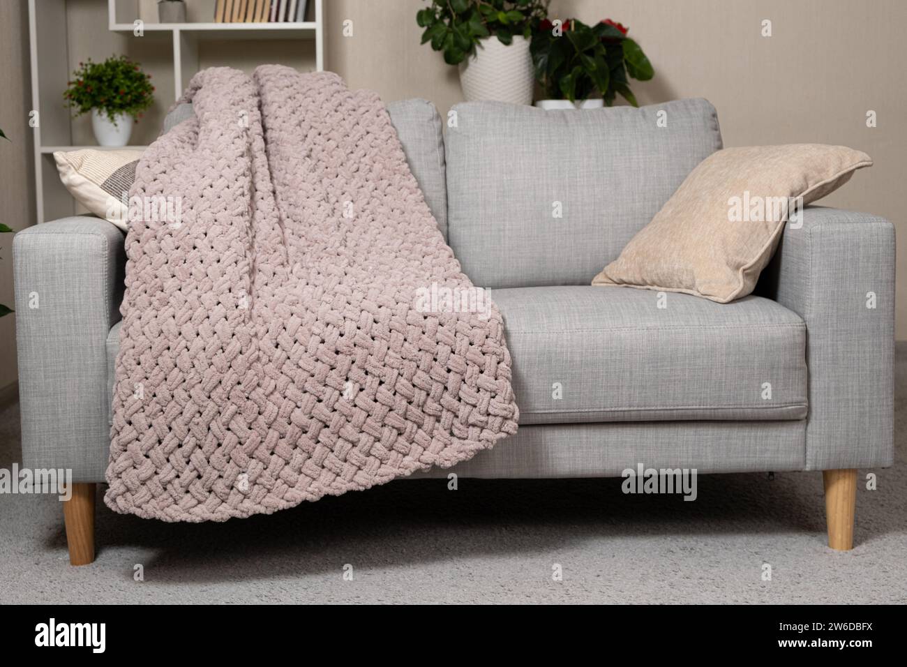Knitted large plaid blanket in dusty rose light grayish-red color on ...