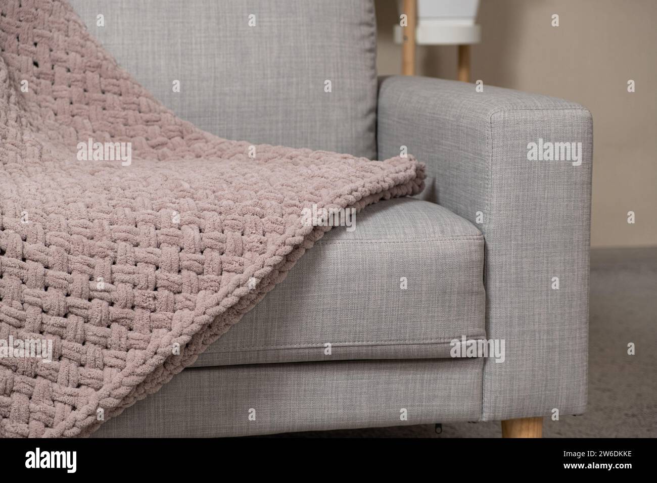 Knitted large plaid blanket in dusty rose light grayish-red color on ...