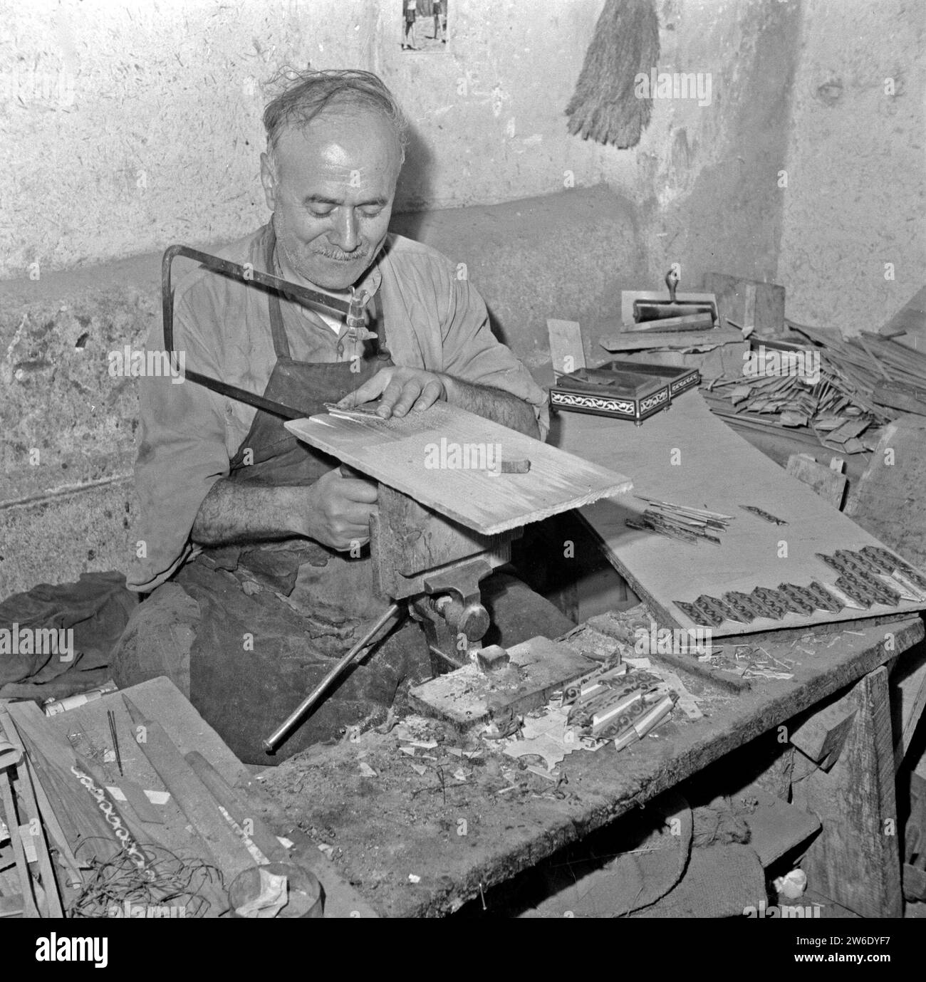Man carving ivory ca. 1950-1955 Stock Photo - Alamy
