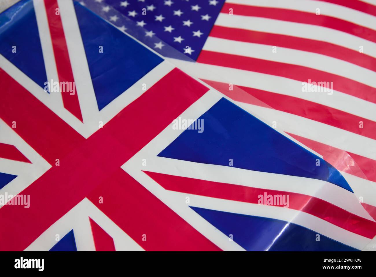 Flat lay of some plastic flags of two sister countries such as the USA ...