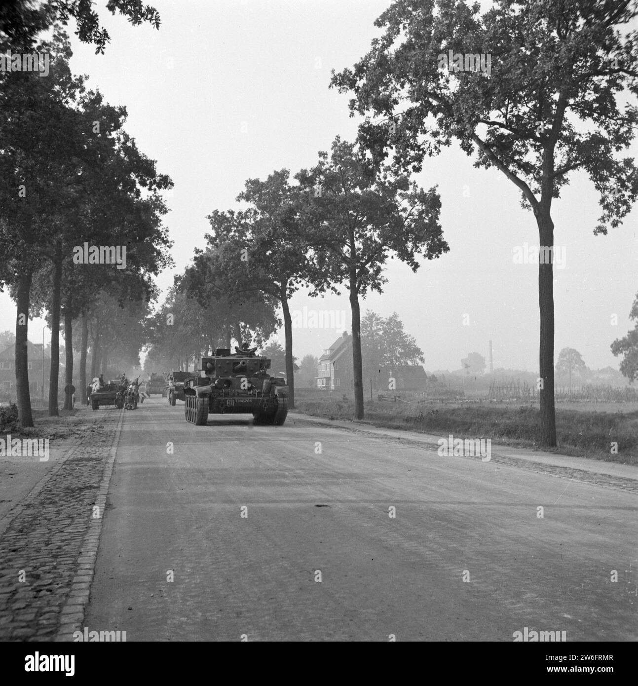 Tank units of the Irish Guards advance through the corridor towards ...