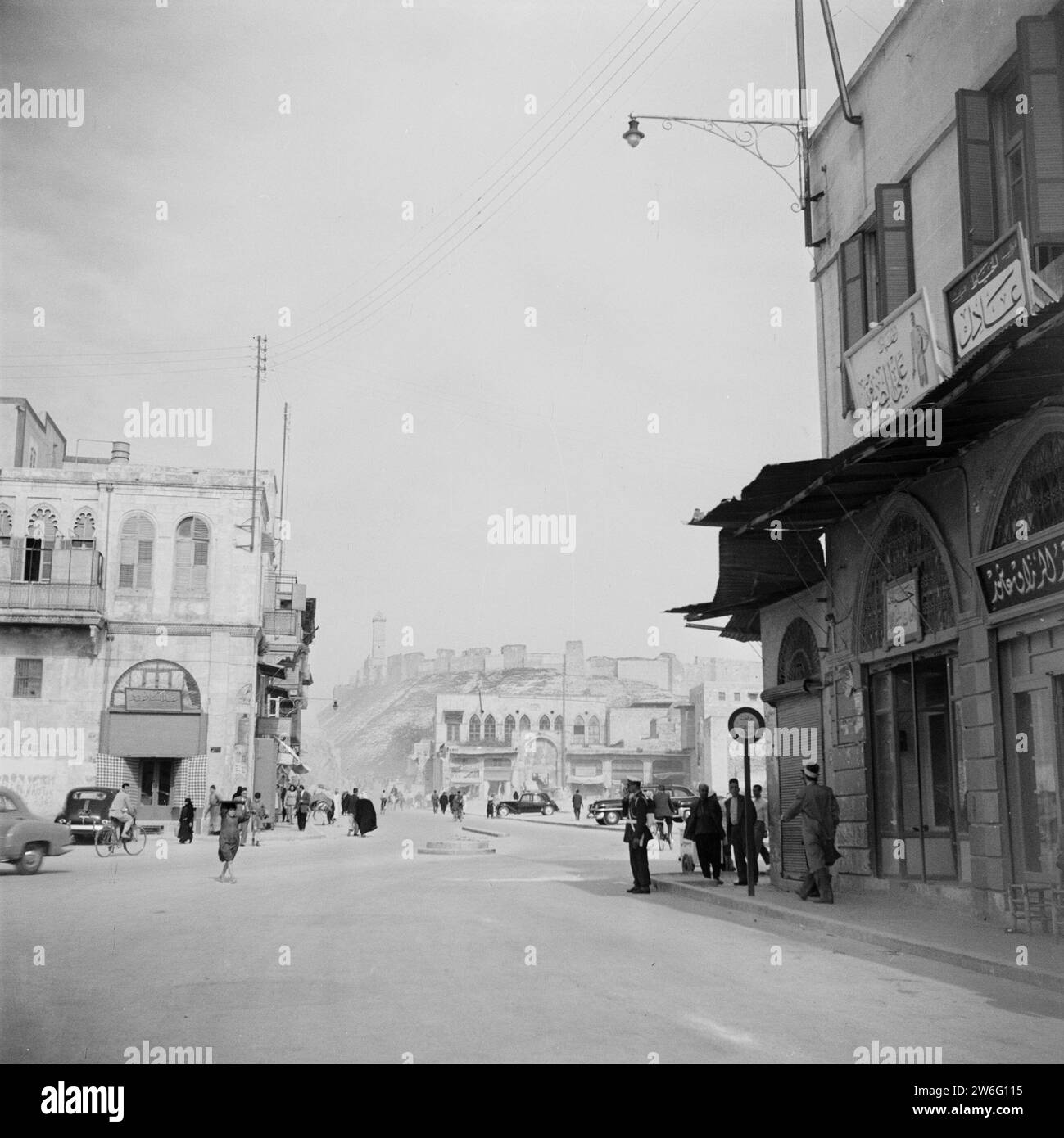 Street scene in the city of Aleppo with the citadel in the background ...