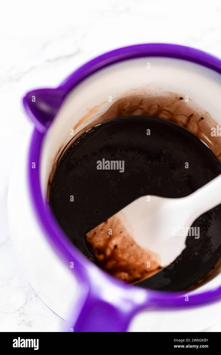 Cocoa Grease-Candy Melting Pot Bundt Prep Stock Photo - Alamy