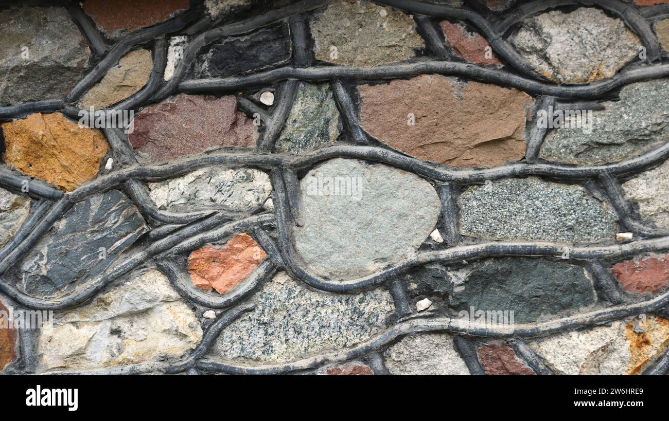 abstract pattern of finishing stones of different types and colors with ...