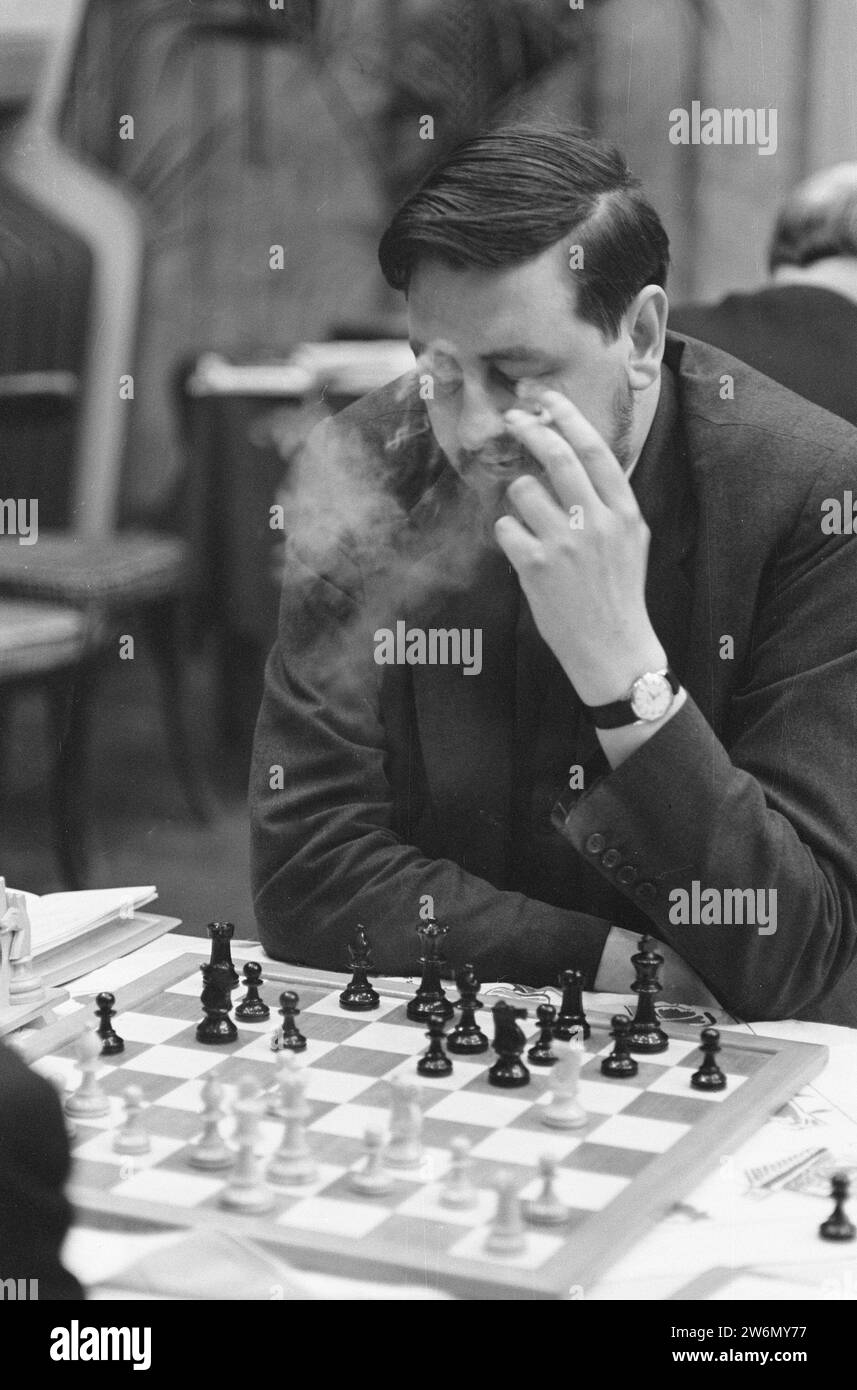 Blast furnace chess tournament. Chess player studies the chess board ...