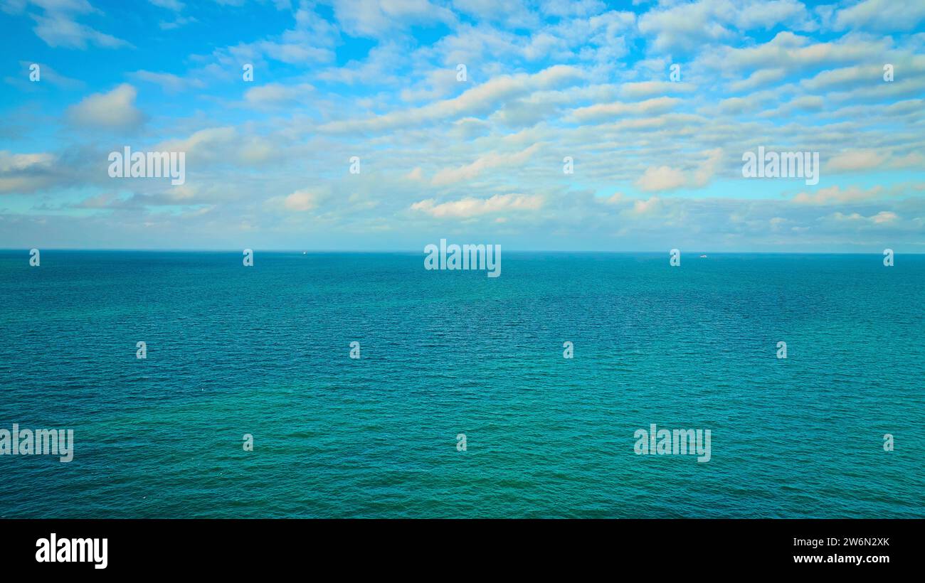 Blue sky with white clouds over blue green water aerial of Lake ...