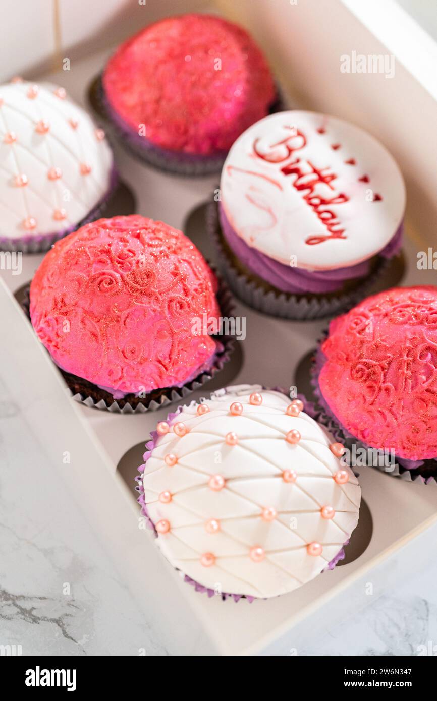 Creating Extravagant Cupcakes for Birthday Celebration Stock Photo - Alamy