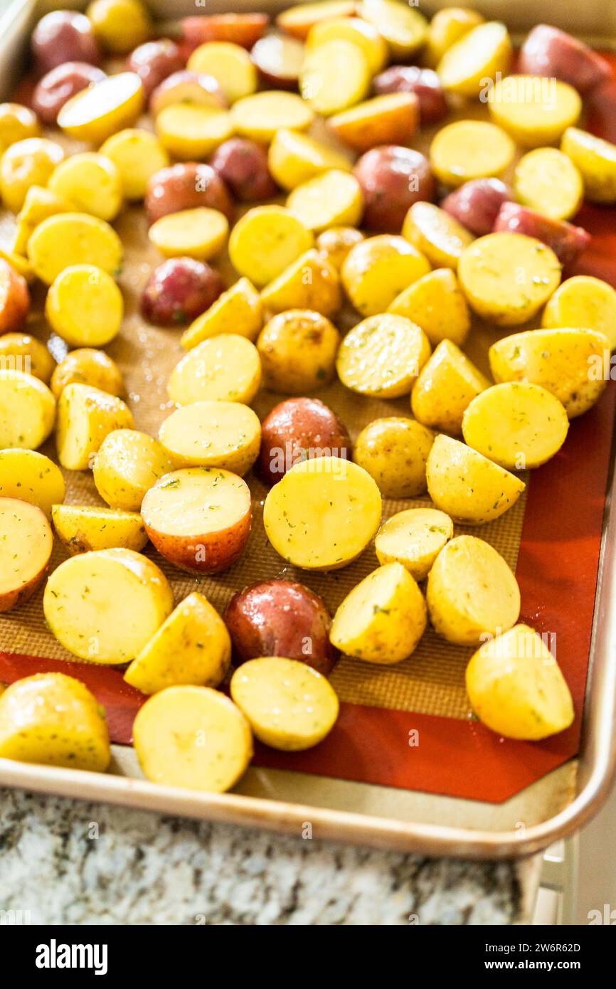 Roasting Halved Mixed Marble Potatoes in Modern Kitchen Stock Photo - Alamy