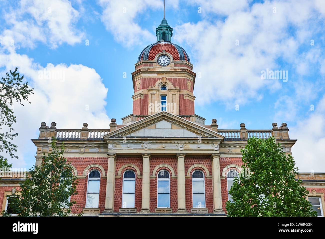 Elkhart County courthouse on blue sky day with fluffy white clouds, law ...