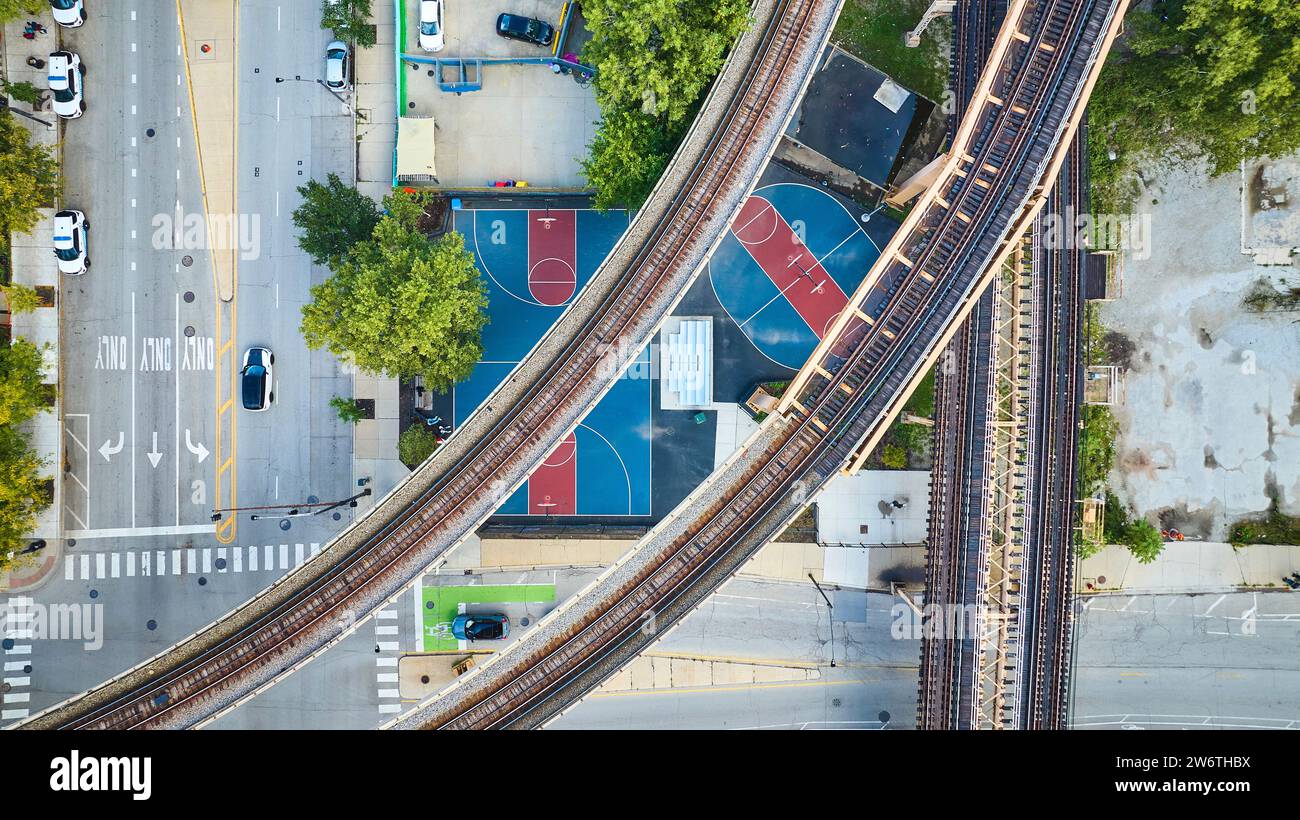 Empty train track tourism transportation bridges above basketball courts aerial, Chicago IL ...