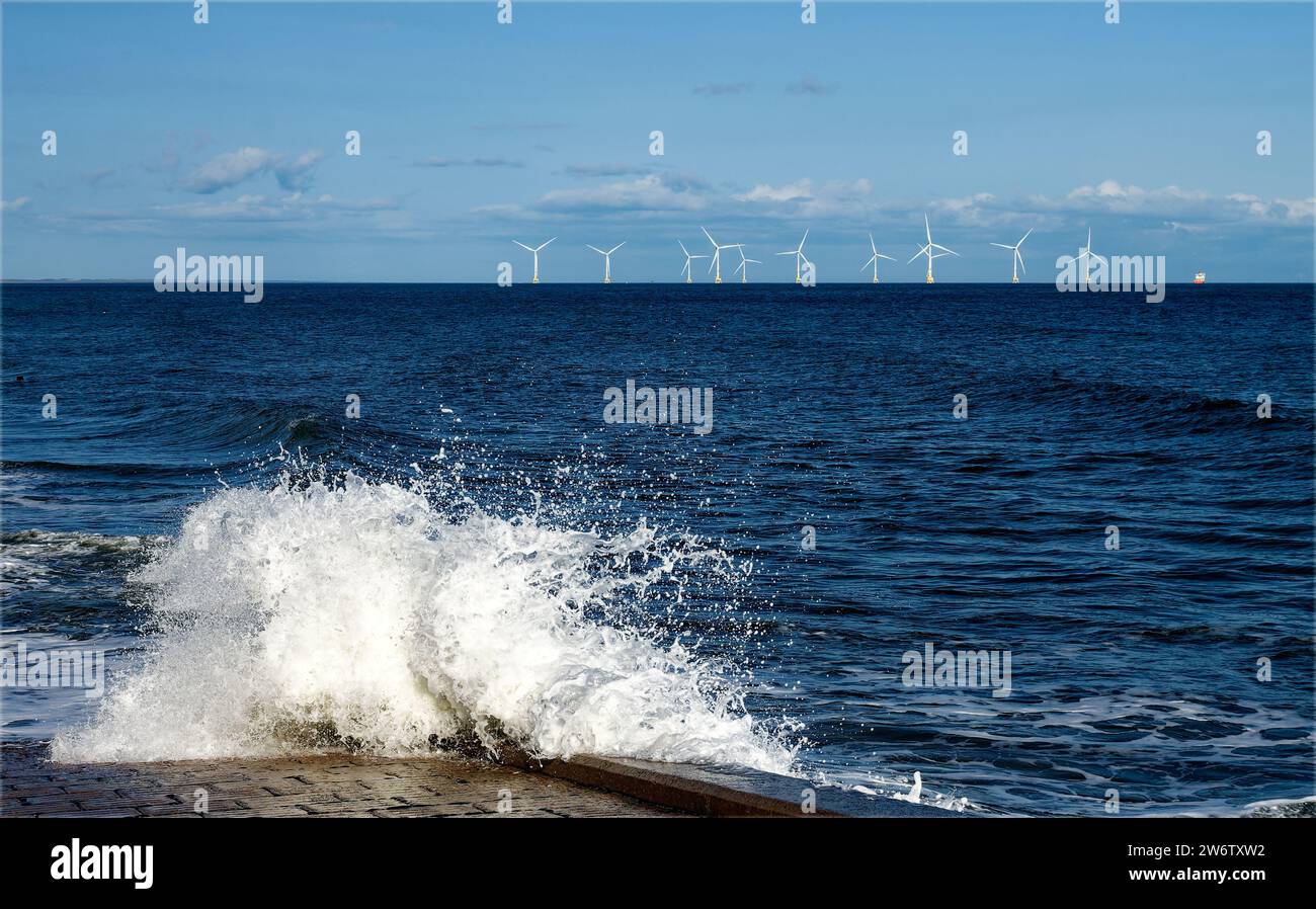 Breaking waves along the Esplanade, Aberdeen, Scotland with an offshore ...