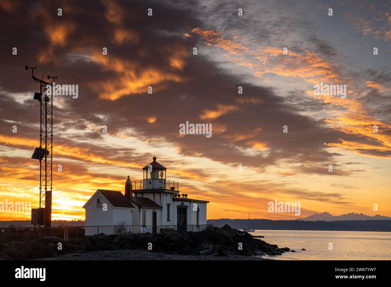 WA2389-00...WASHINGTON -Colorful sunset at West Point Lighthouse in ...
