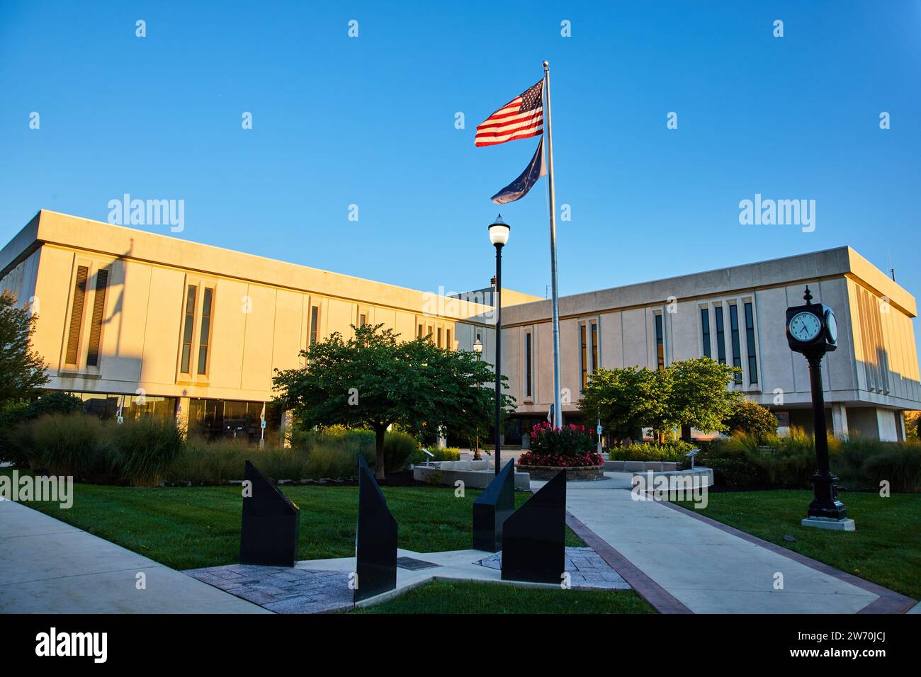 American Flag and Modern Courthouse at Sunrise with Garden Stock Photo ...