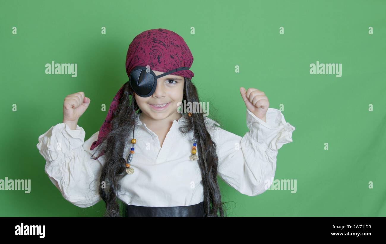 Adorable kid pirate with long hair and eye patch pissing with angry ...