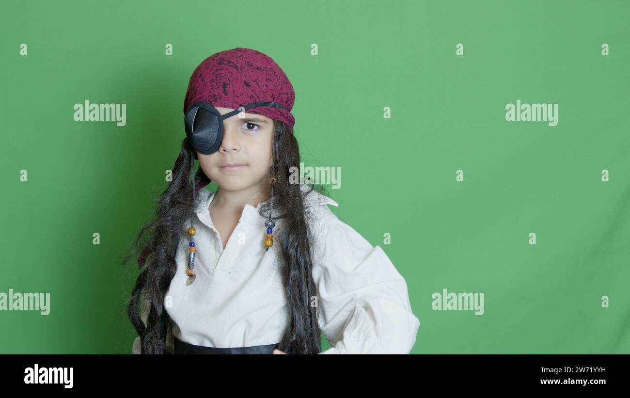 Adorable kid pirate with long hair and eye patch pissing with angry ...