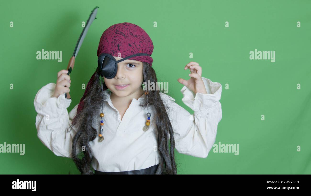 Adorable kid pirate with long hair and eye patch pissing with angry ...