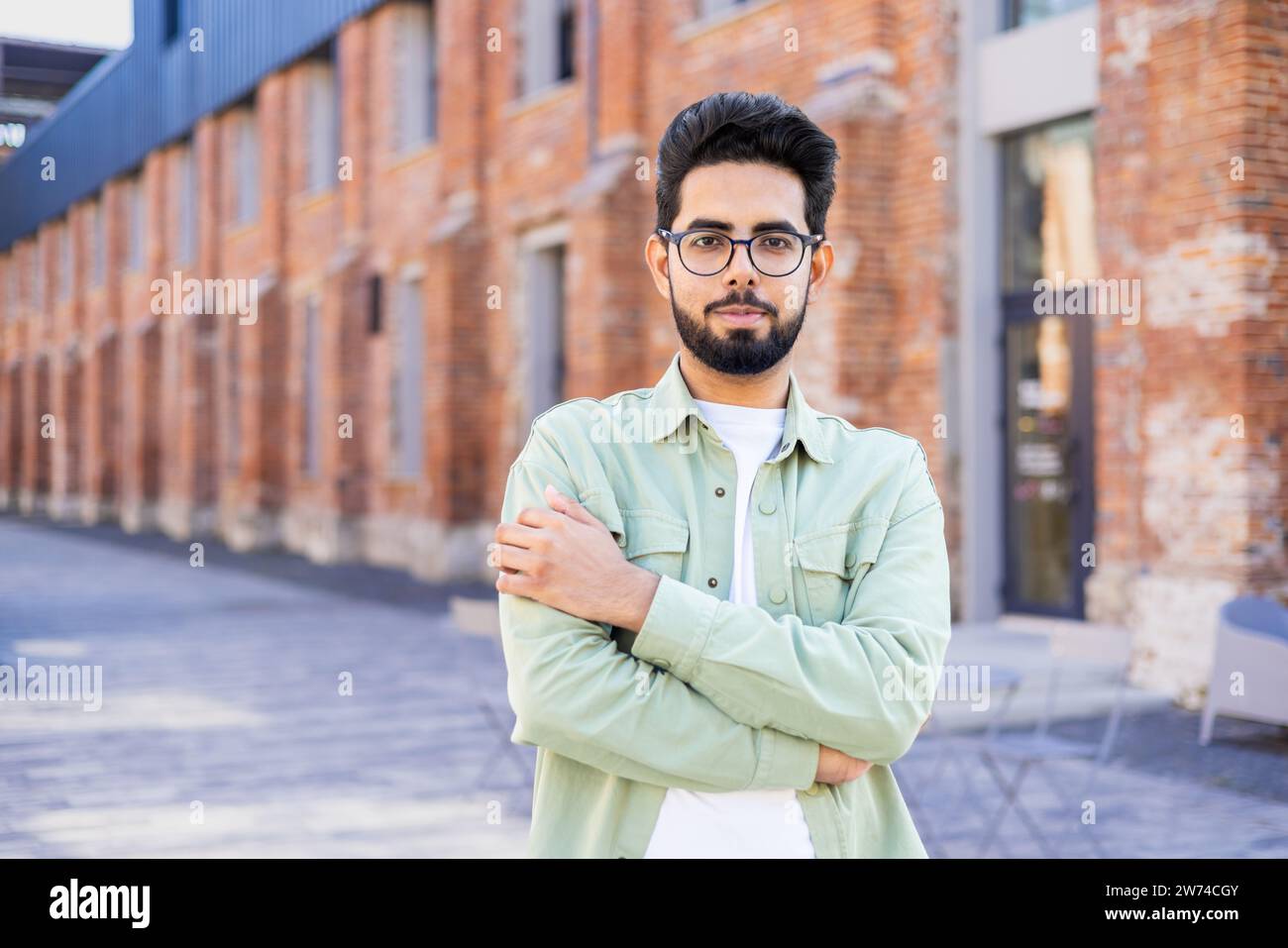 Indian man standing confidently hi-res stock photography and images - Alamy
