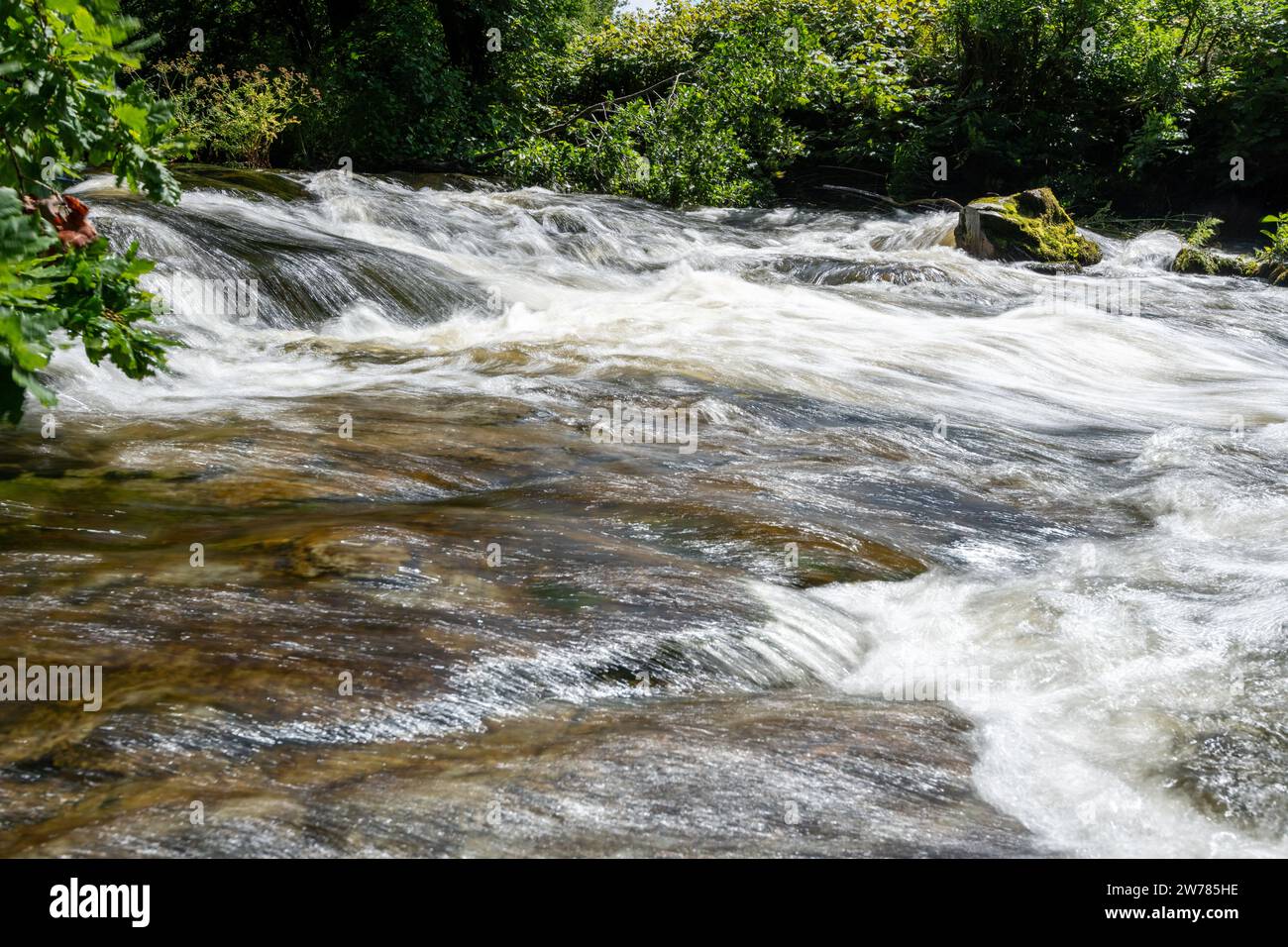 Long exposure of a waterfall on the East Lyn river flowing through the ...