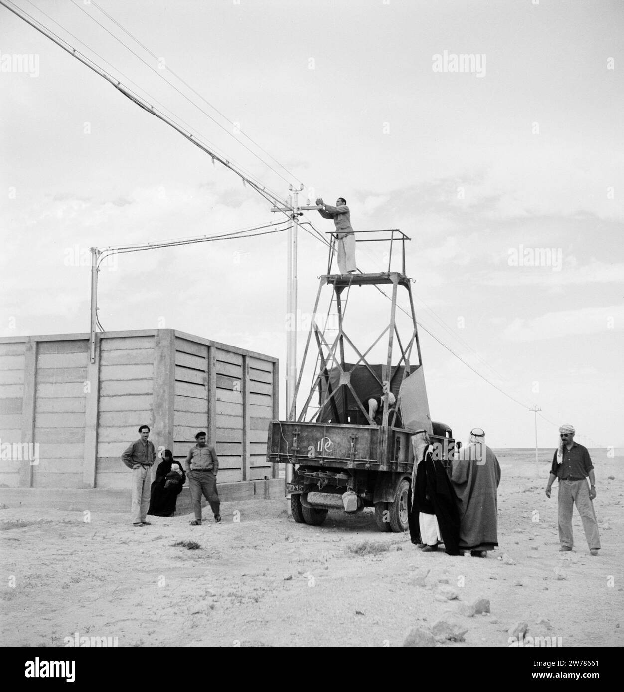Repair of the telephone line in the desert ca. 1950-1955 Stock Photo ...