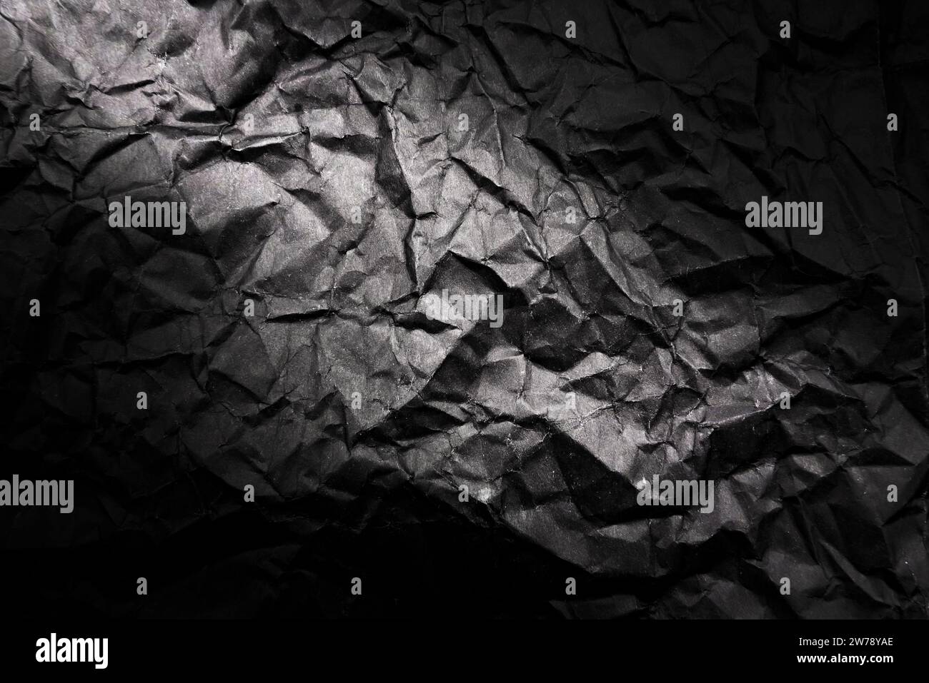 Texture of crumpled black paper with gradient. Dark paper background ...